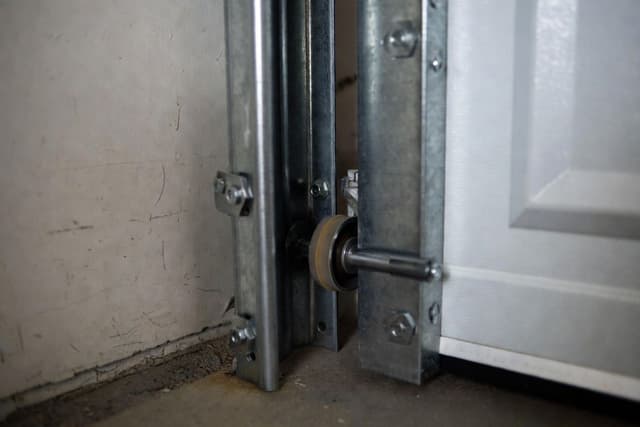 Garage Door Off Track: Causes, How to Fix It, and When to Call a Pro ...